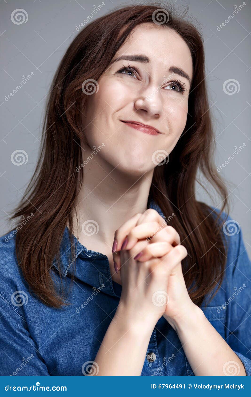 Woman is Looking Imploring Over Gray Background Stock Image - Image of ...