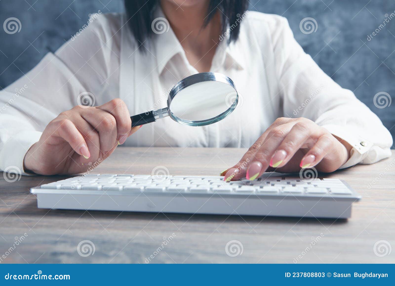 Woman Looking at the Keyboard with a Magnifying Glass Stock Image ...