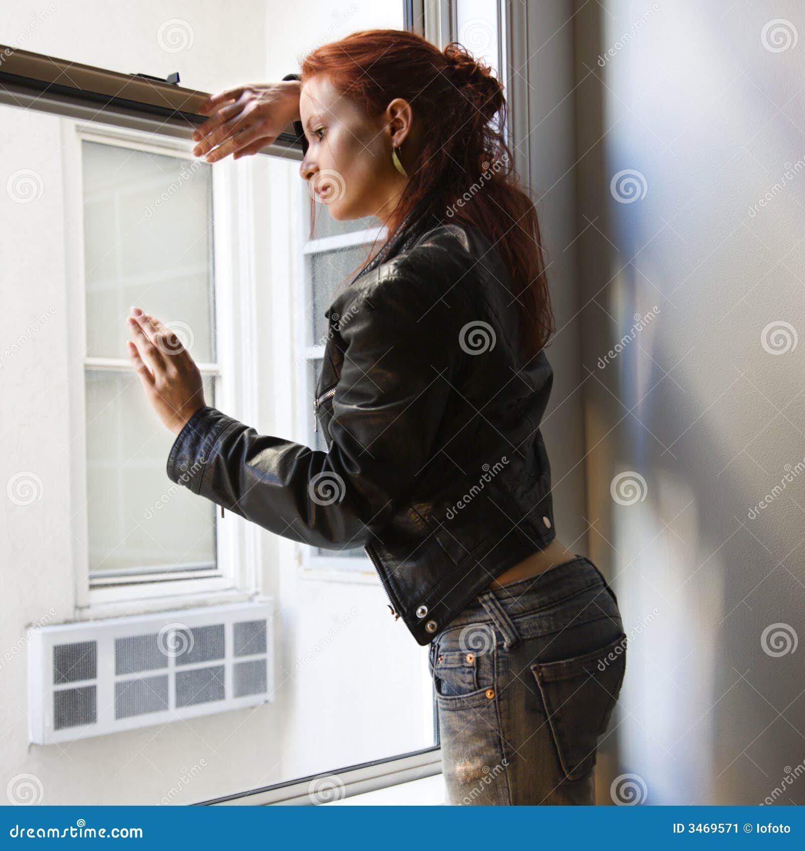 Woman looking out window. stock image. Image of length - 3469571