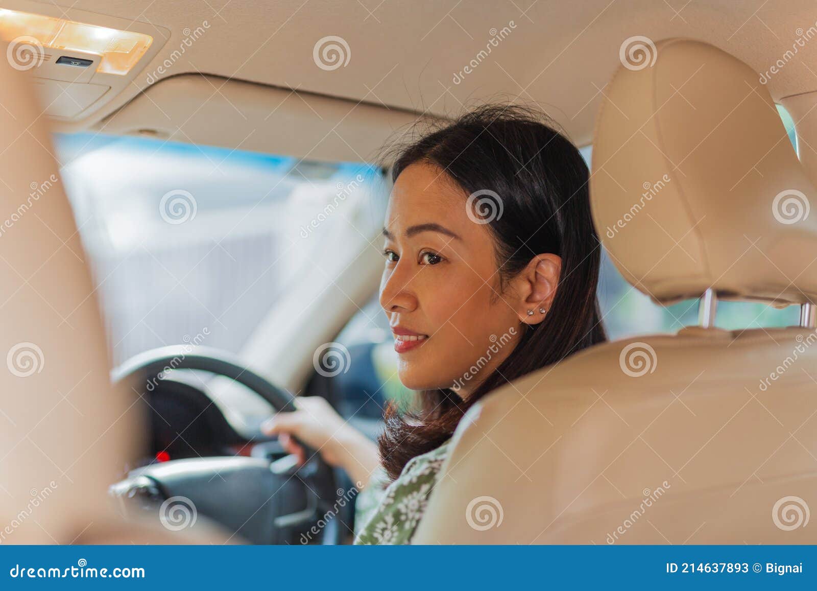 Woman Looking Over Her Shoulder while Driving a Car. Stock Image ...