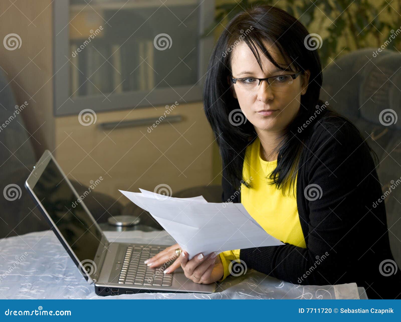 Woman Looking Over Paperwork Stock Photo - Image of bill, working: 7711720