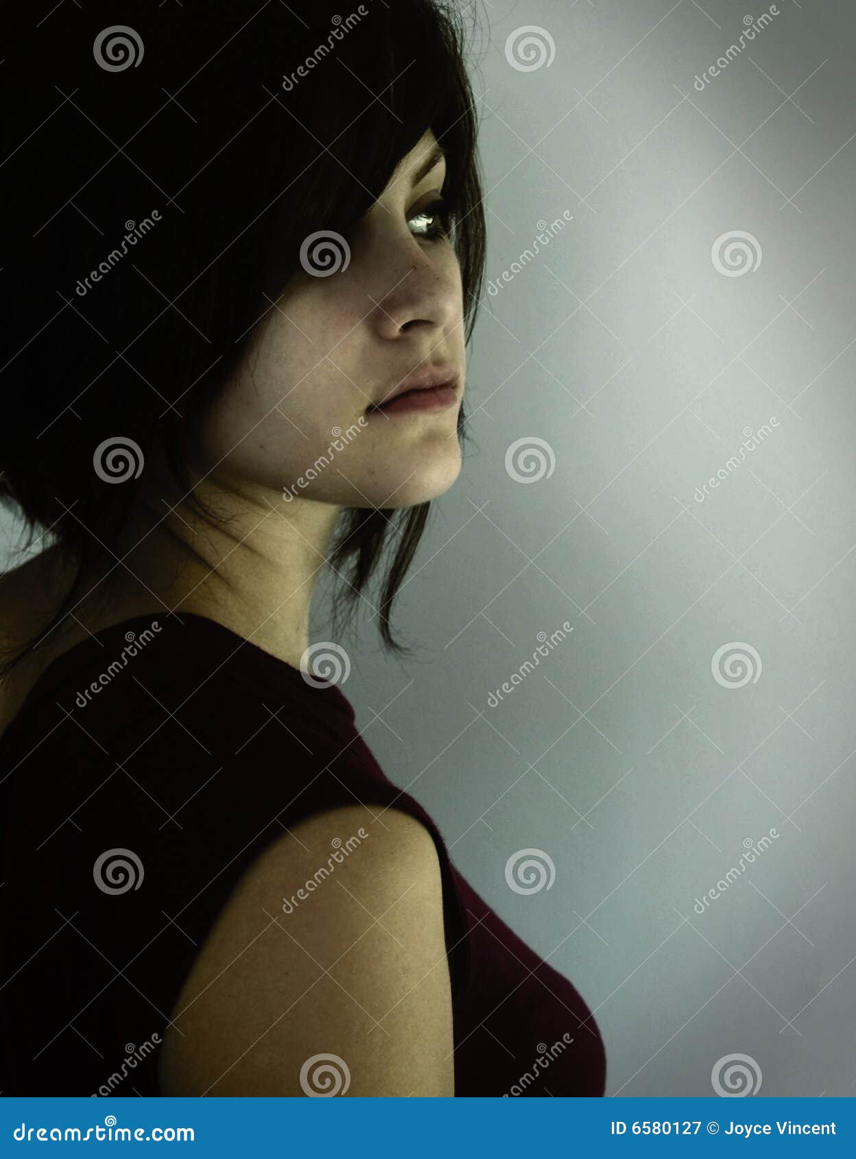 Woman Looking Over Shoulder Stock Image - Image of expressive, cross ...
