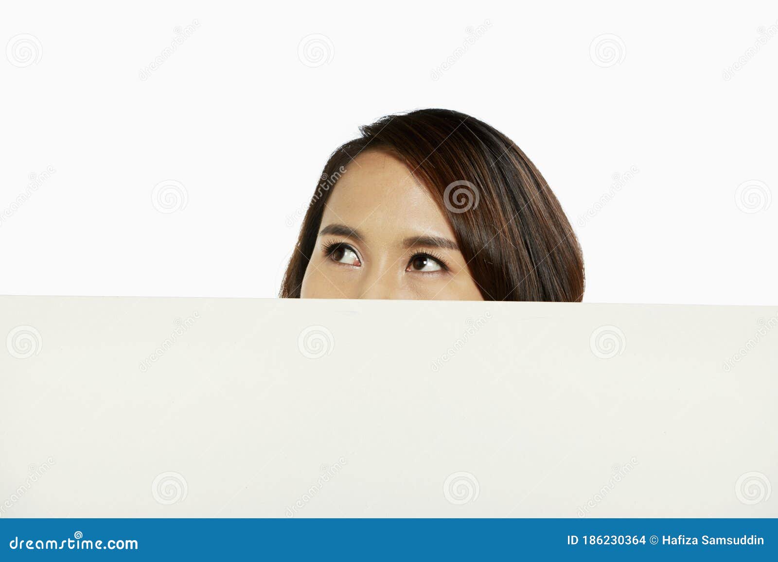 Woman looking over a wall stock photo. Image of korea - 186230364