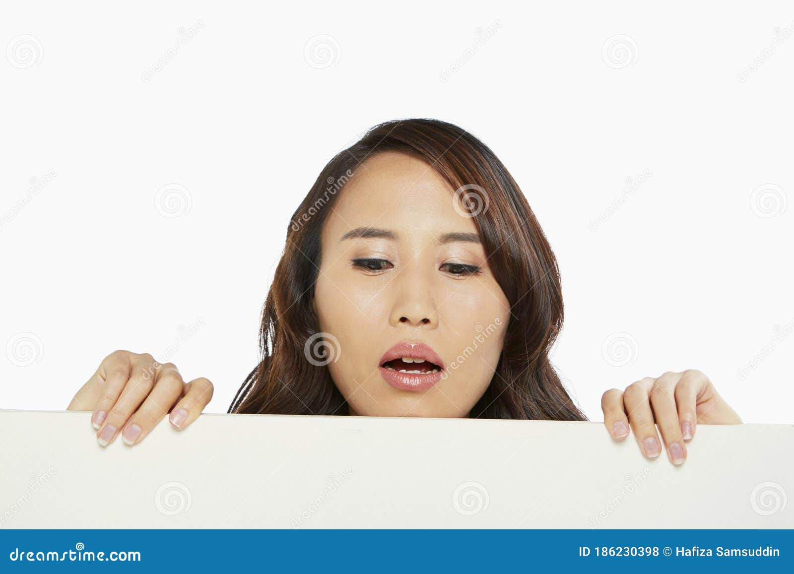 Woman looking over a wall stock photo. Image of creativity - 186230398