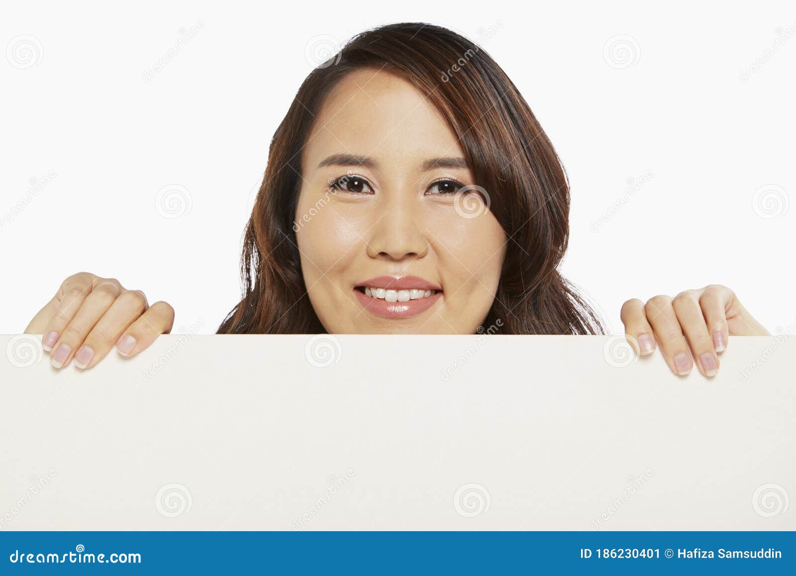 Woman looking over a wall stock image. Image of person - 186230401