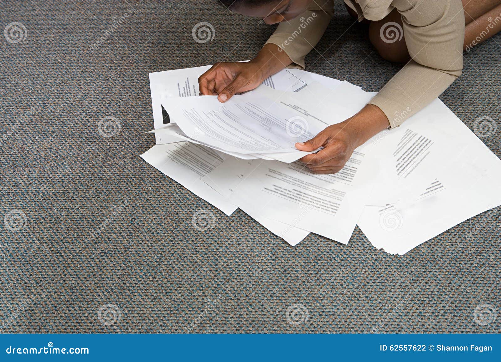 Woman Looking at Paperwork on Floor Stock Photo - Image of looking ...