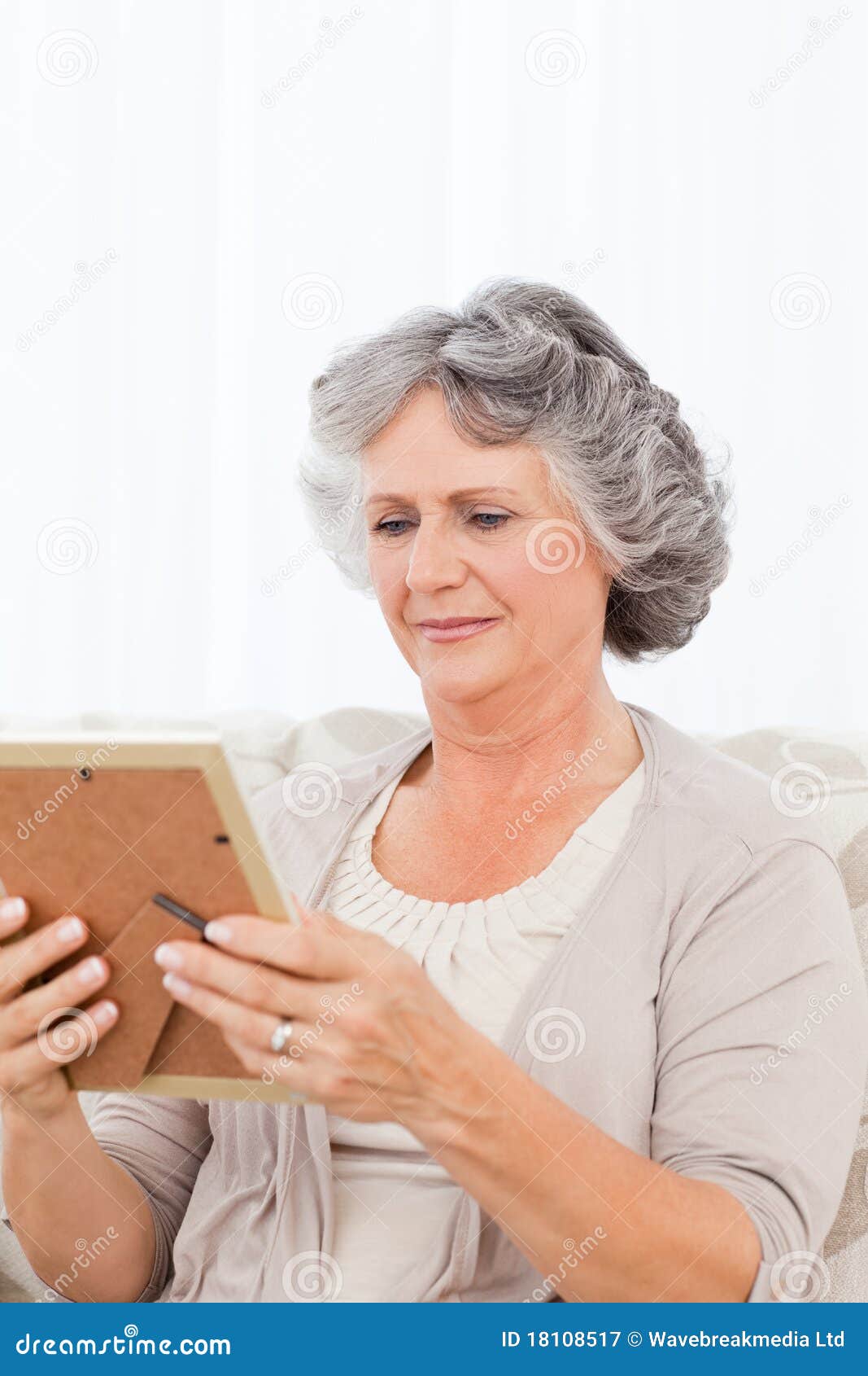 Woman looking at a photo stock image. Image of relaxation - 18108517