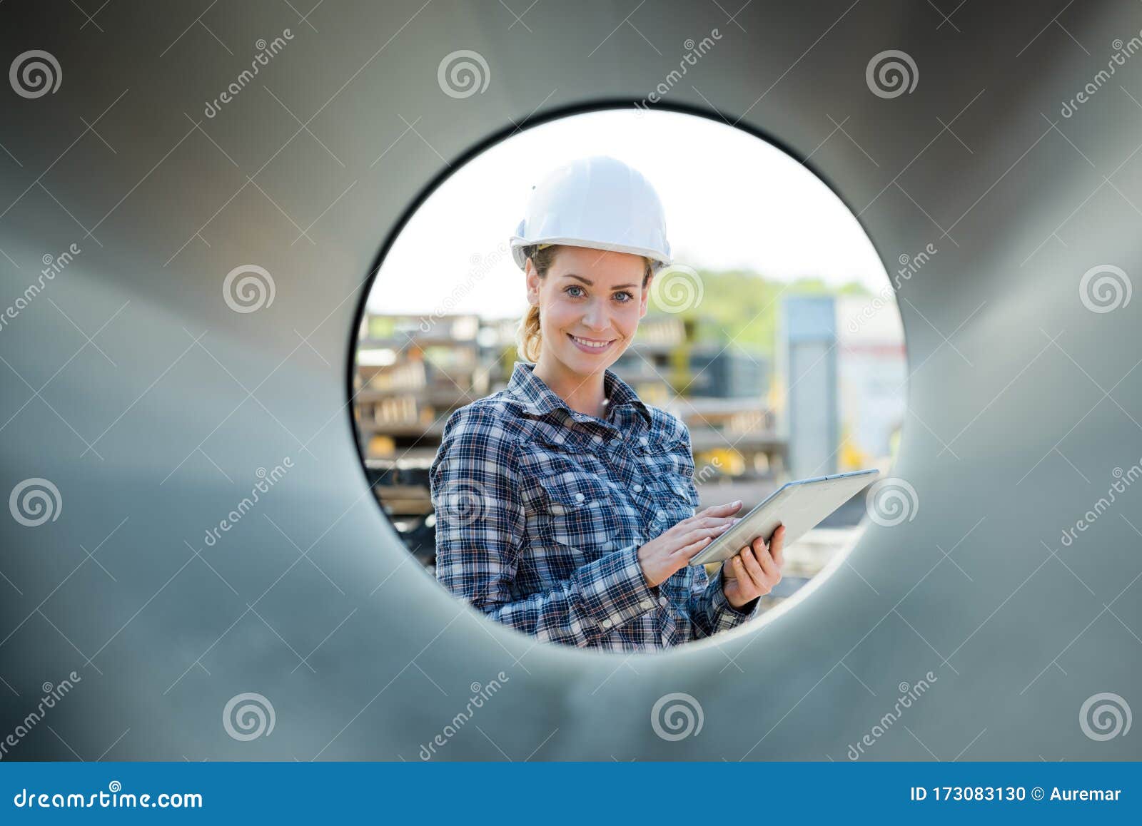 Woman looking through pipe stock photo. Image of garden - 173083130