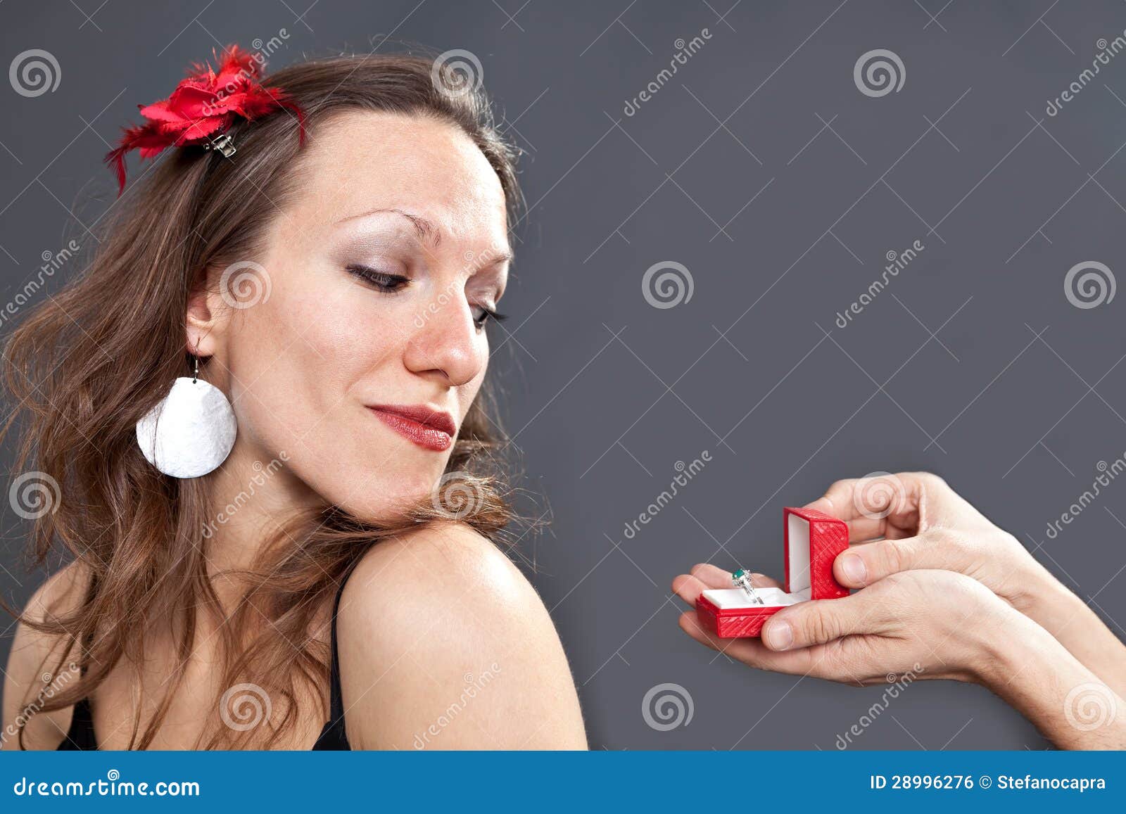 Woman looking at the ring stock photo. Image of girlfriend - 28996276