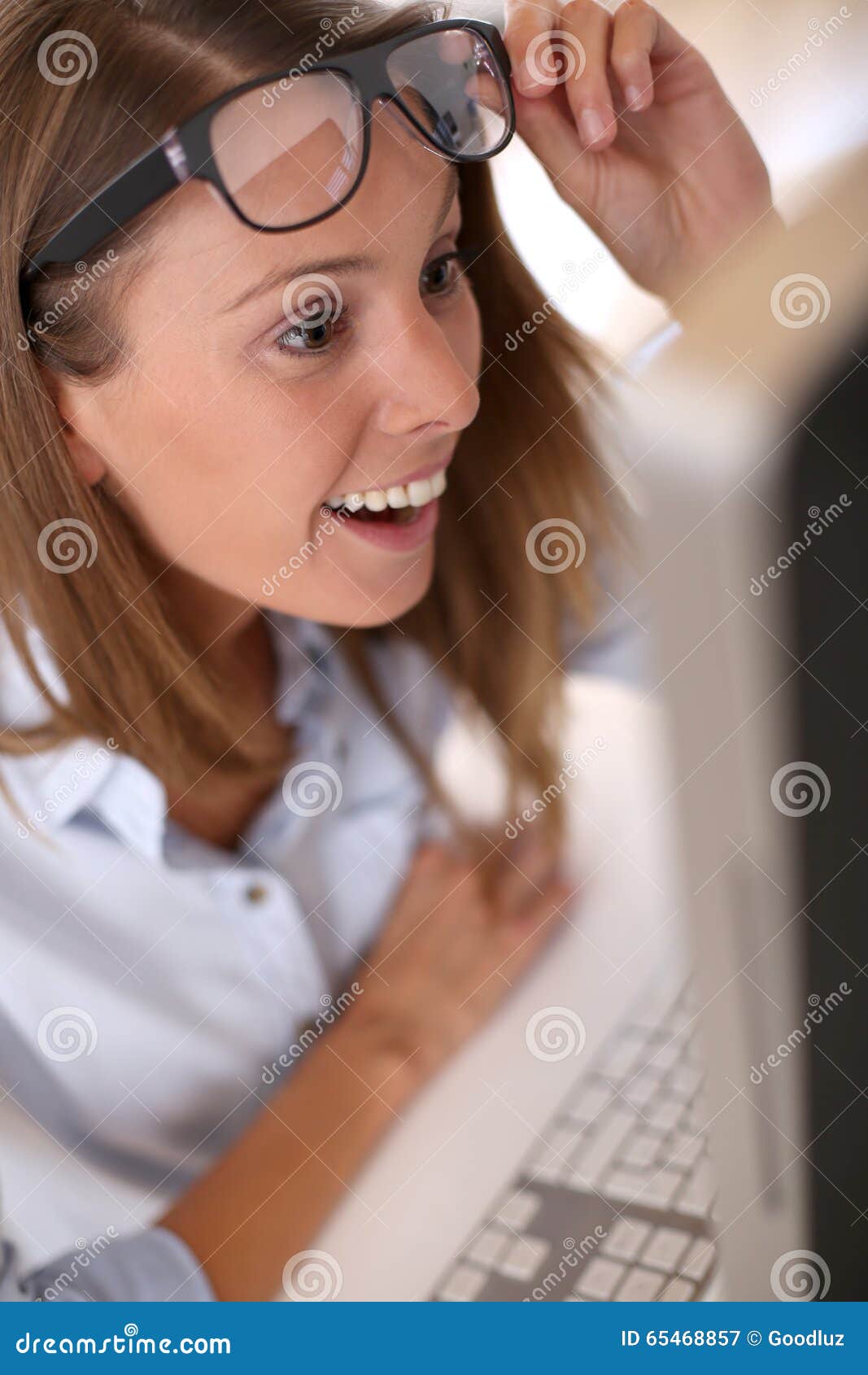 Woman Looking at Screen with Surprised Look Stock Image - Image of ...