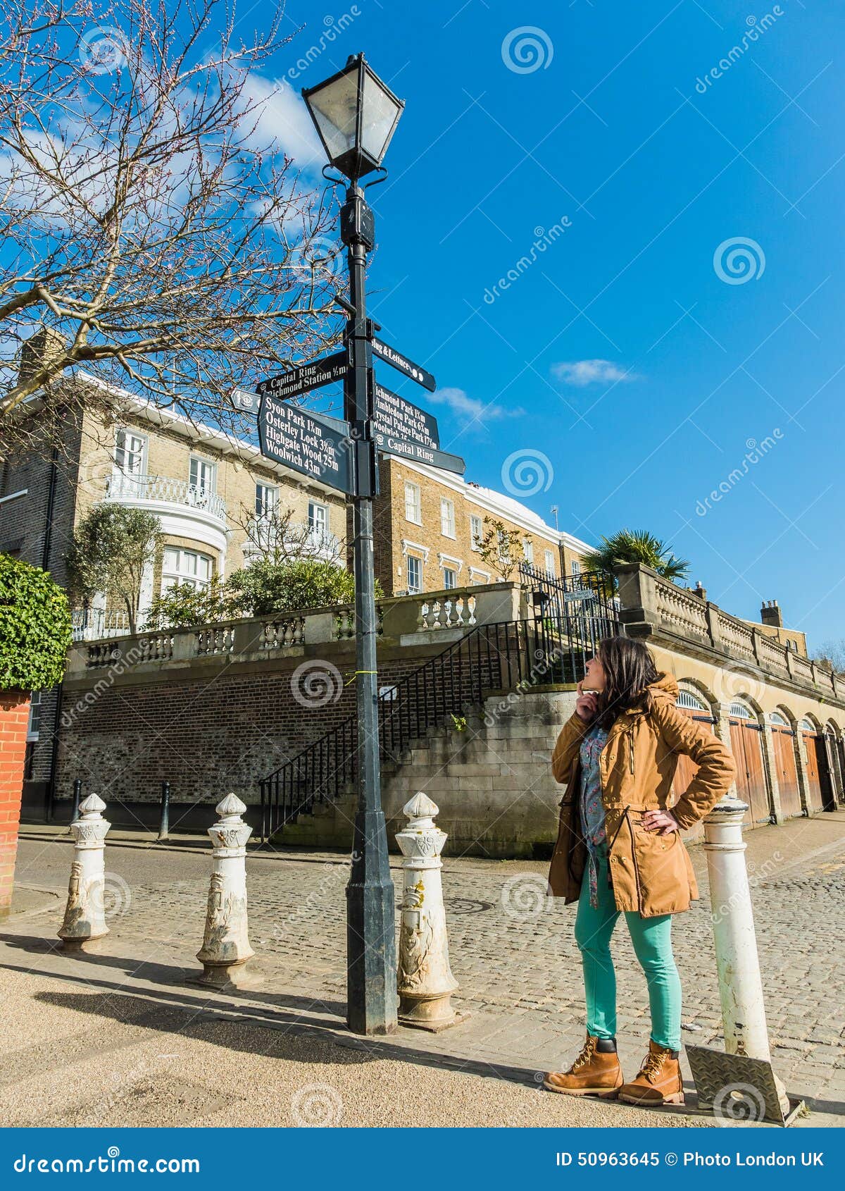 Woman Looking at a Sign Post Stock Image - Image of asphalt, abstract ...