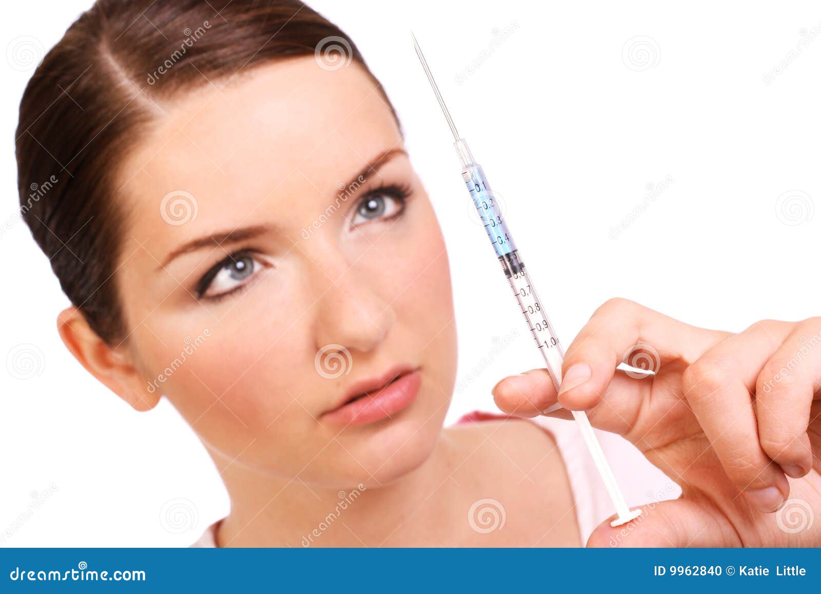 Woman looking at a syringe stock photo. Image of cleanliness - 9962840