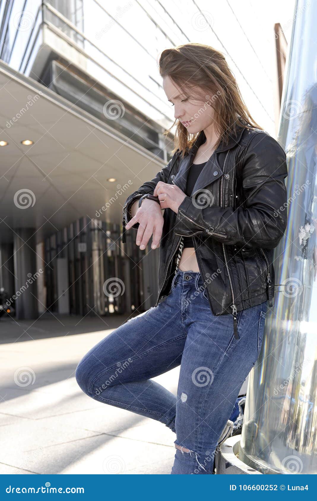 Woman looking at watch stock photo. Image of smartwatch - 106600252