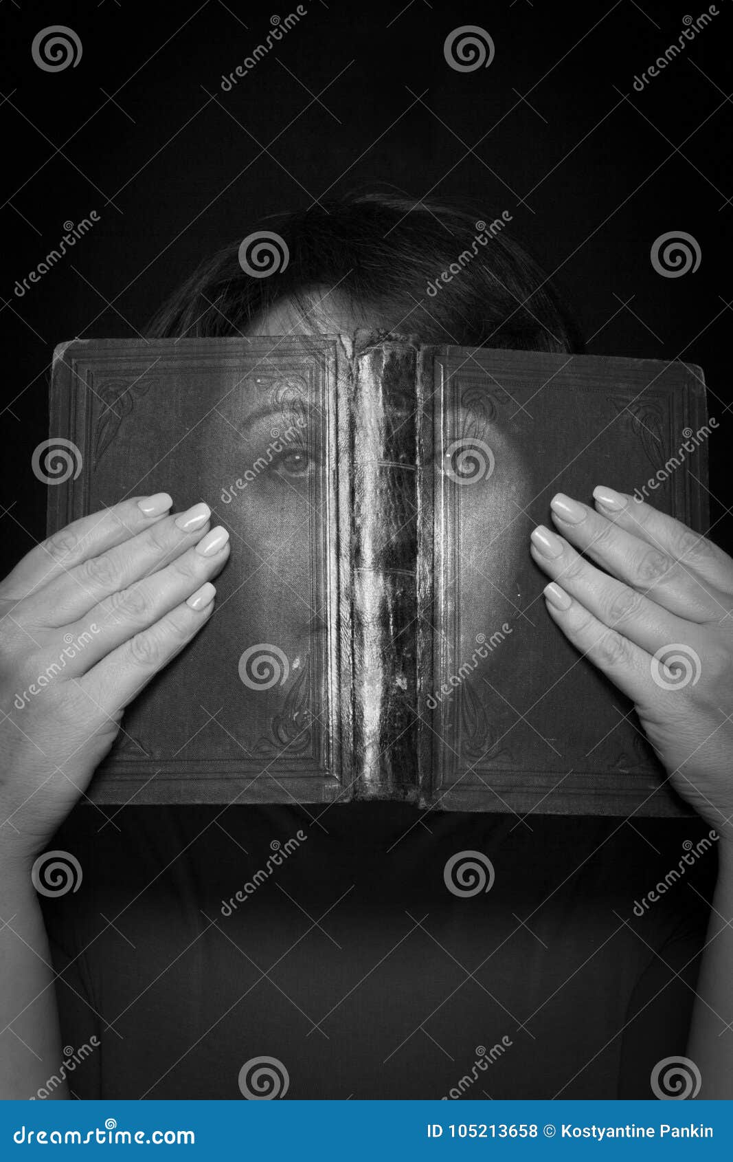 A Woman Looks through a Book Stock Photo - Image of stylish, lifestyle ...
