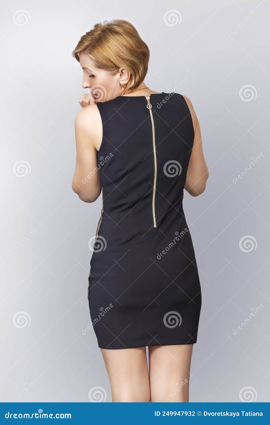 The Woman Looks Cautiously Over Her Shoulder Checking Her Hips Stock ...