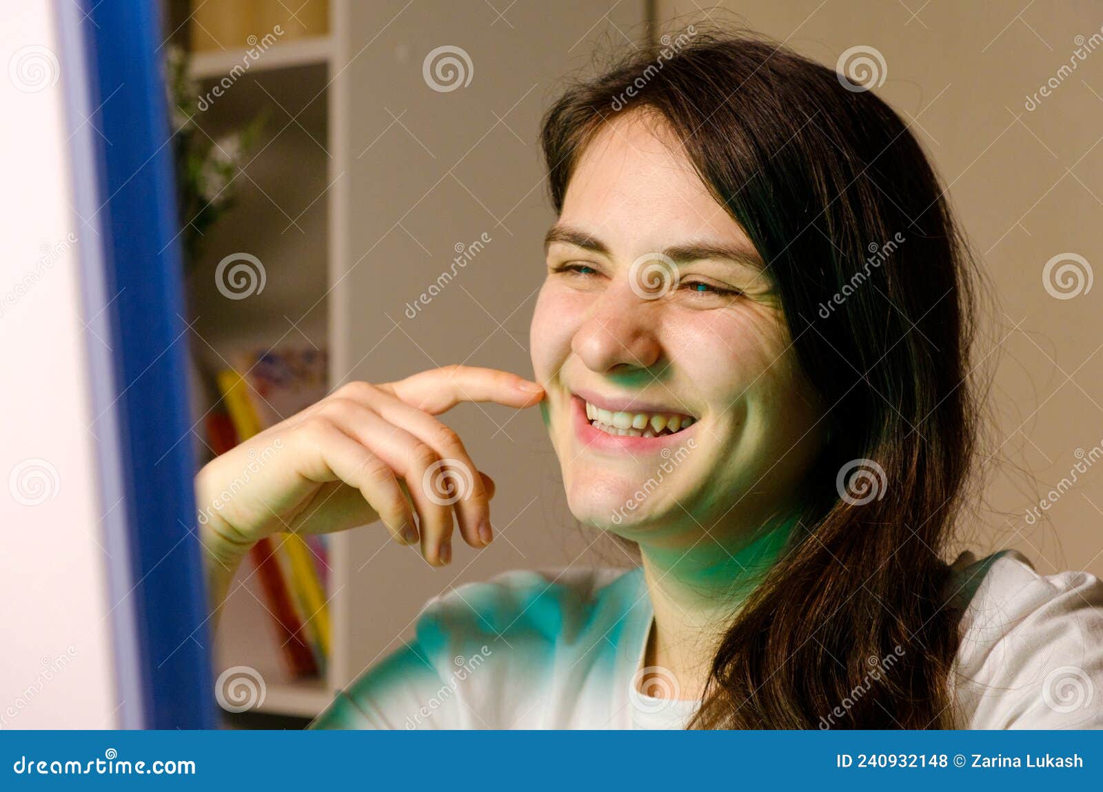 The Woman Looks at the Computer Screen and Smiles. Stock Photo - Image ...