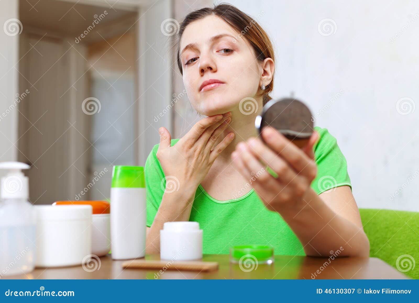 Woman looks on her neck stock image. Image of care, clean - 46130307