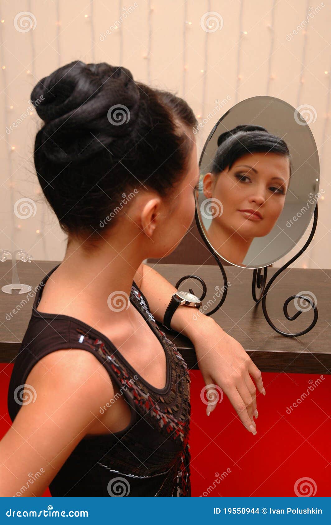 The Woman Looks into Mirror Stock Photo - Image of cosmetic, woman ...