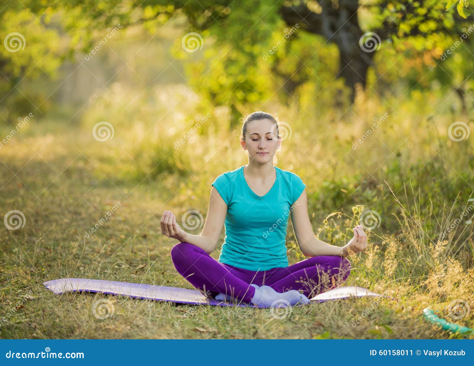 Woman in lotus position stock image. Image of girl, park - 60158011