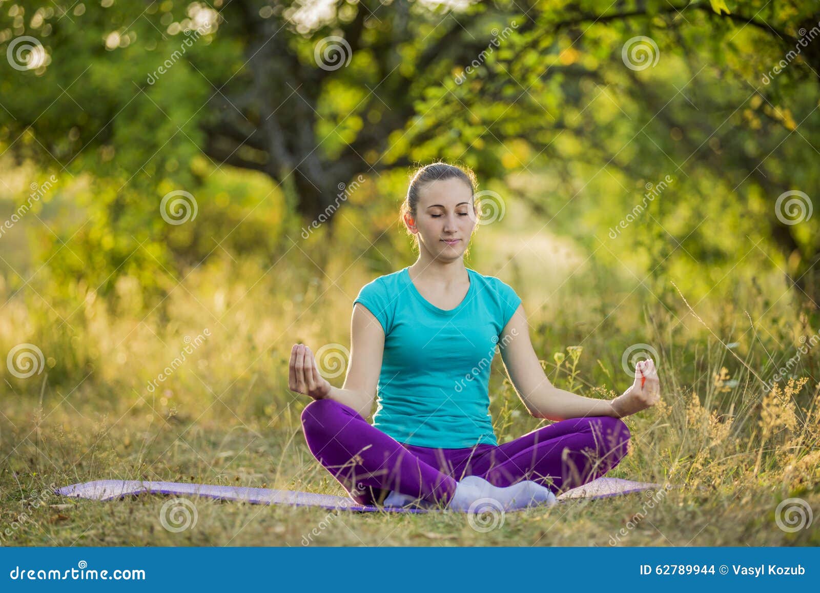 Woman in lotus position stock photo. Image of health - 62789944
