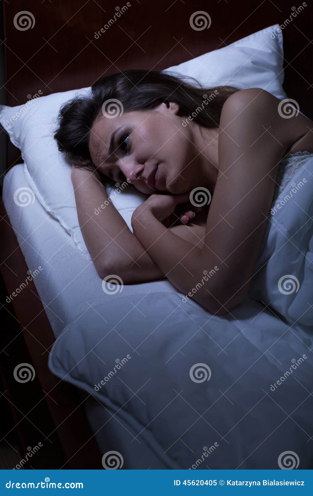 Woman lying in bed awake stock image. Image of bedroom - 45620405
