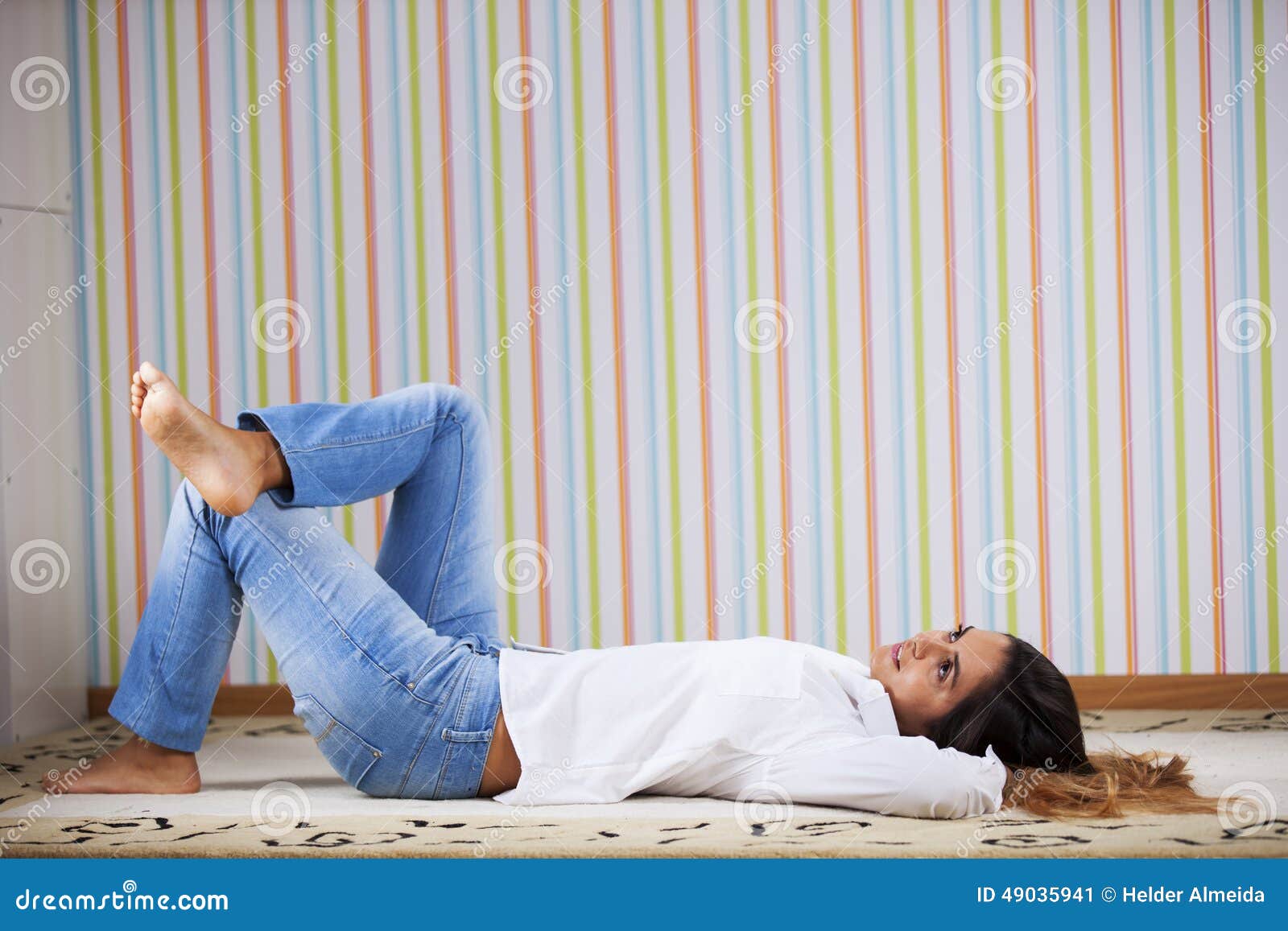 Woman lying in the carpet stock image. Image of female - 49035941