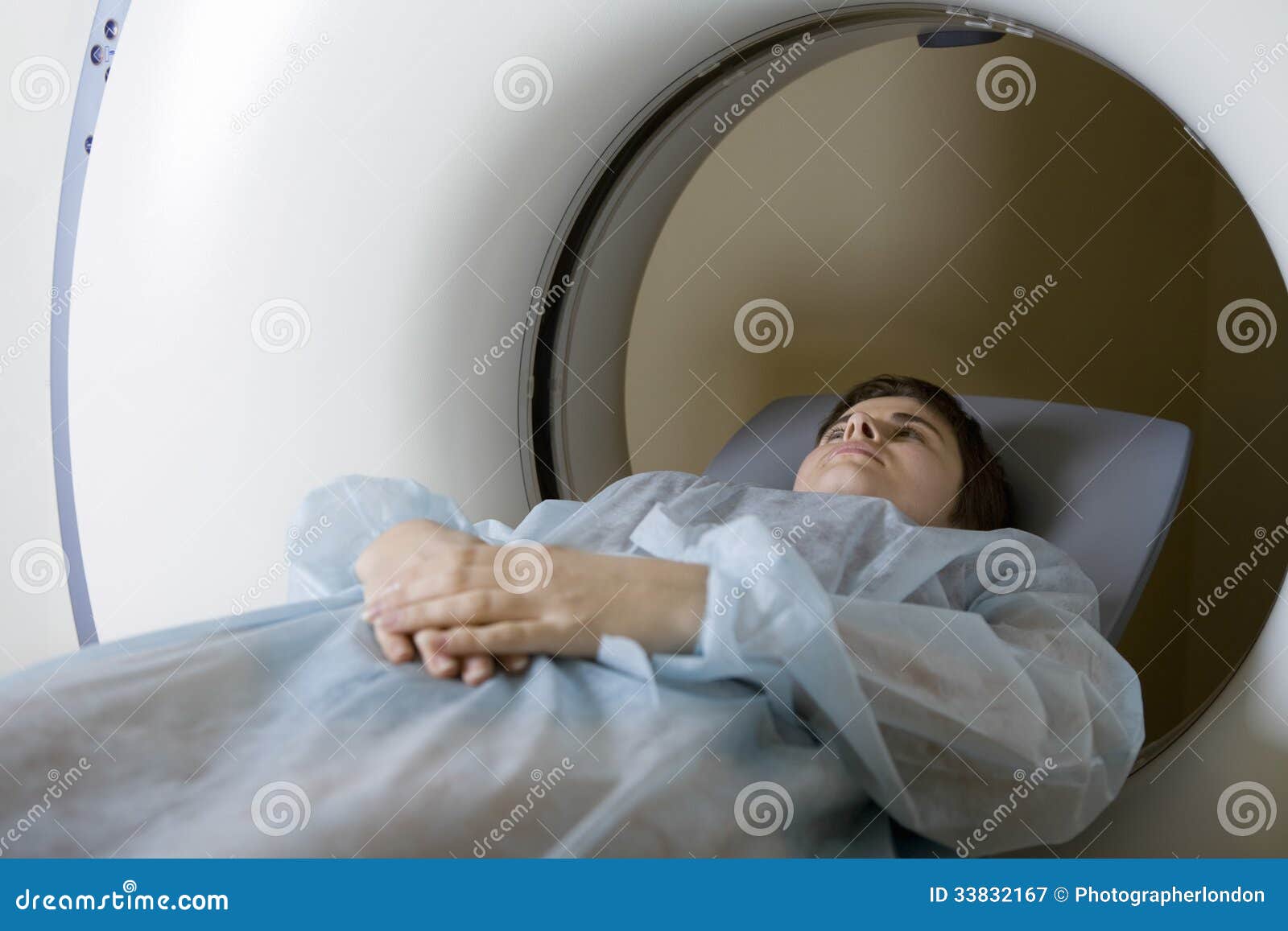 Woman Lying in CAT Scan Machine Stock Image - Image of machine, hands ...
