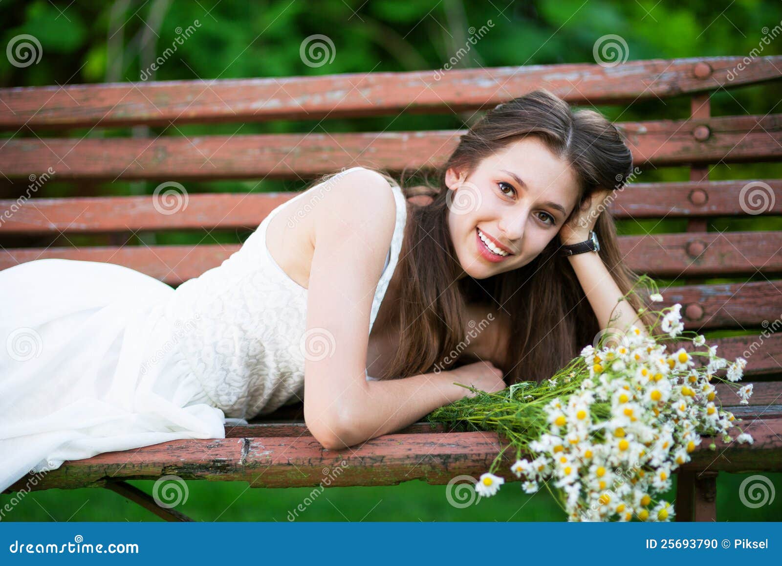 Woman lying down on bench stock photo. Image of summertime - 25693790