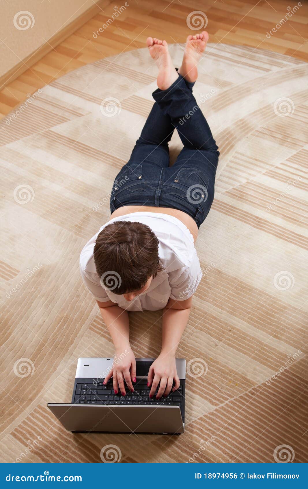 Woman Lying on Floor and Using Laptop Stock Photo - Image of interior ...