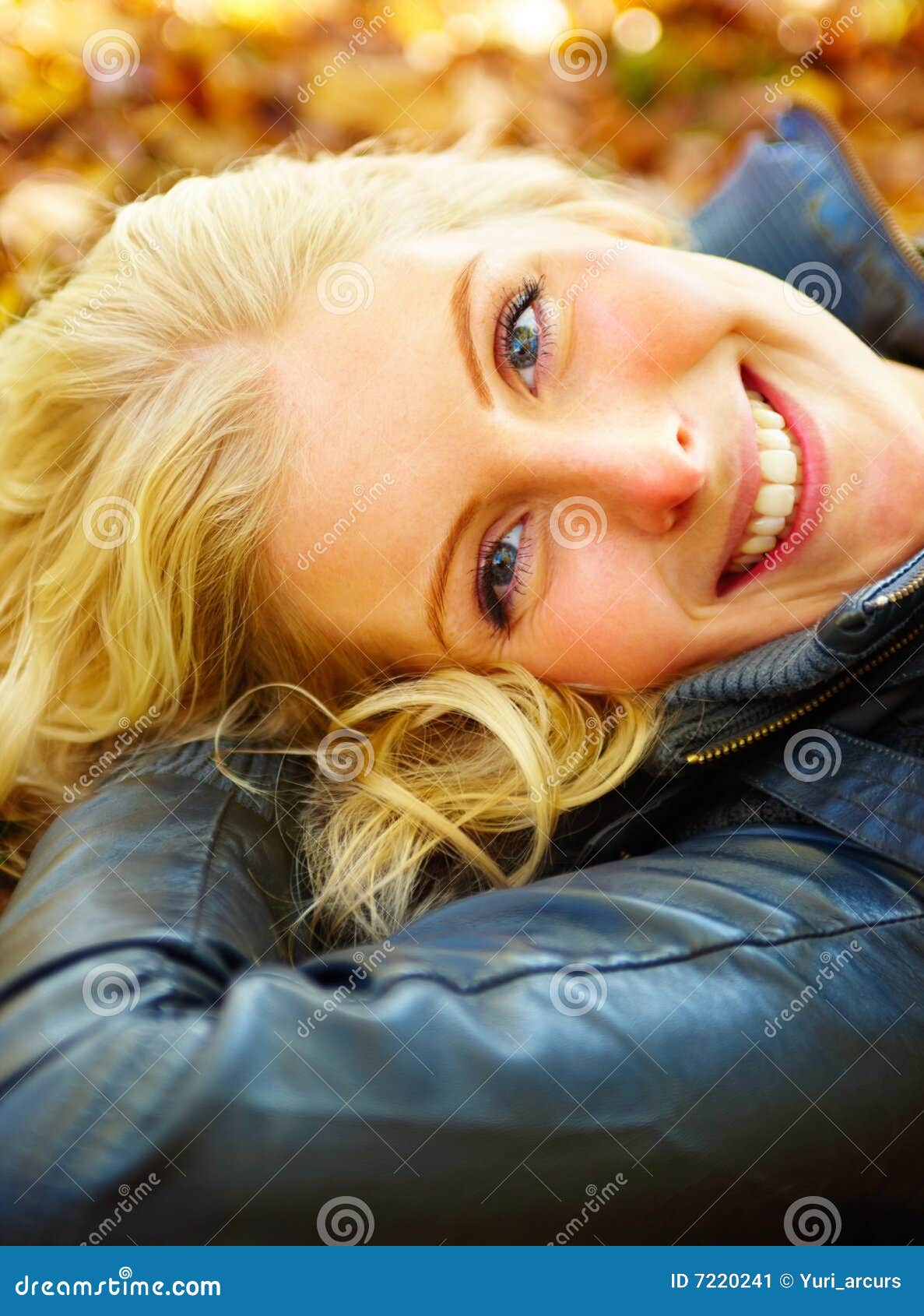 Woman Lying on Ground Looking Up and Smiling Stock Image - Image of ...