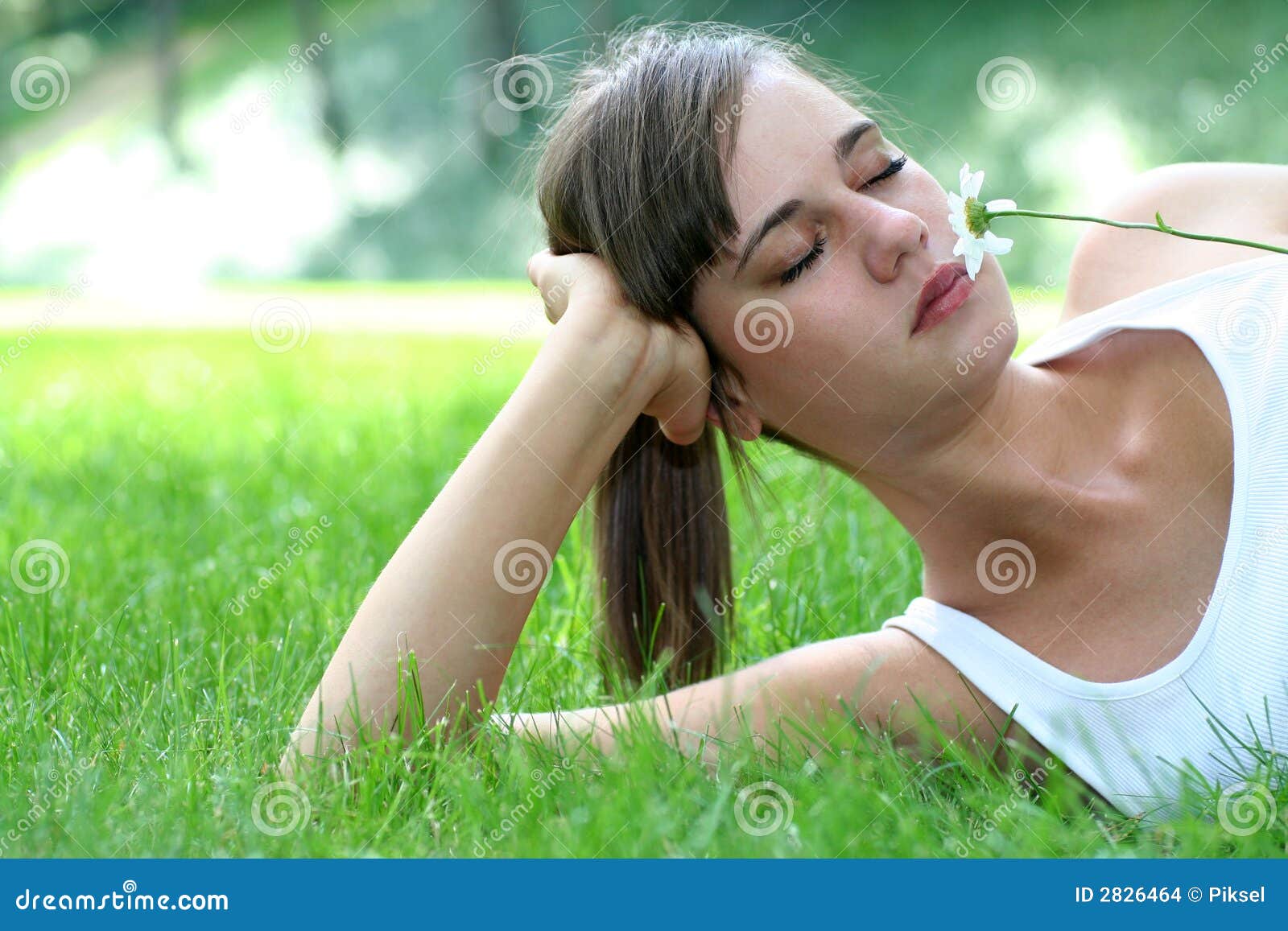 Woman Lying on a Lawn Smelling Stock Photo - Image of female, park: 2826464