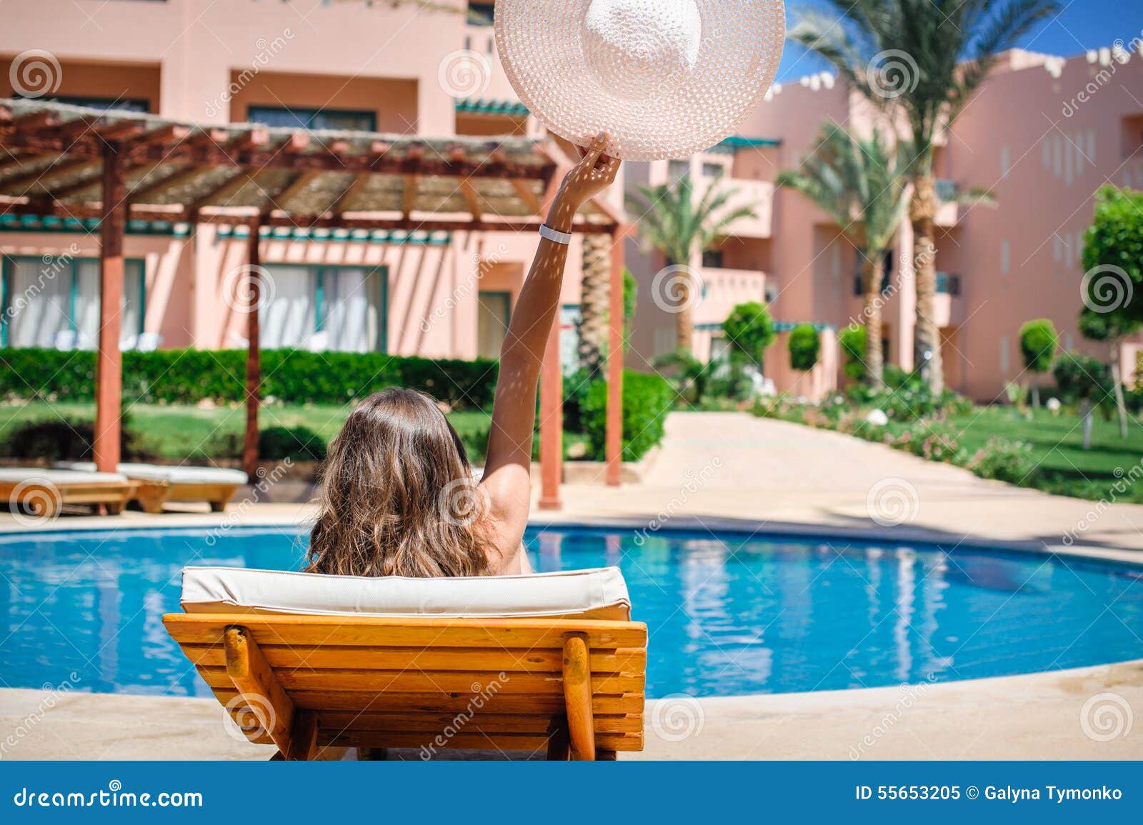 Woman Lying on a Lounger by the Pool at the Hotel Stock Image - Image ...
