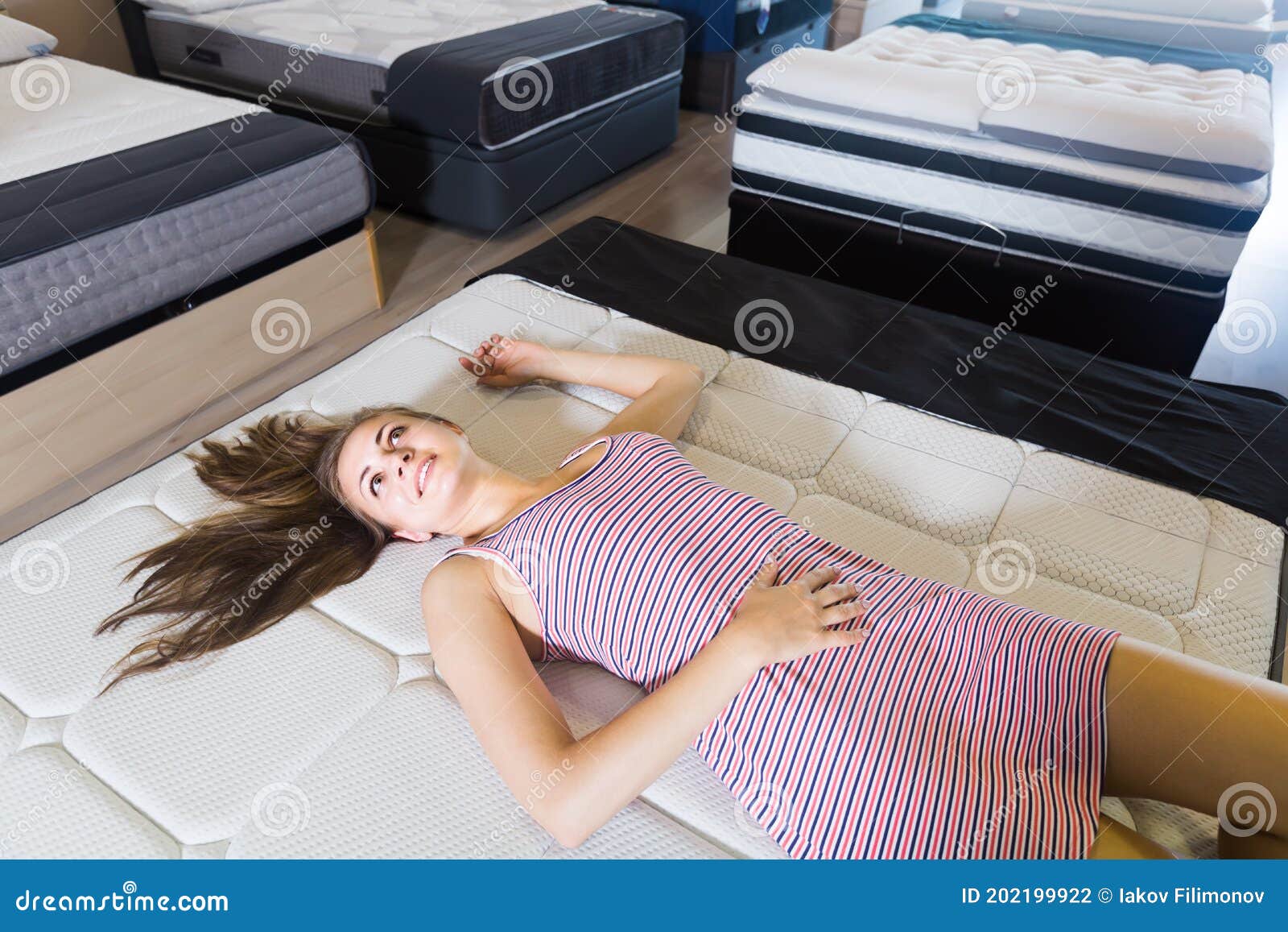 Woman lying on mattress stock photo. Image of family - 202199922