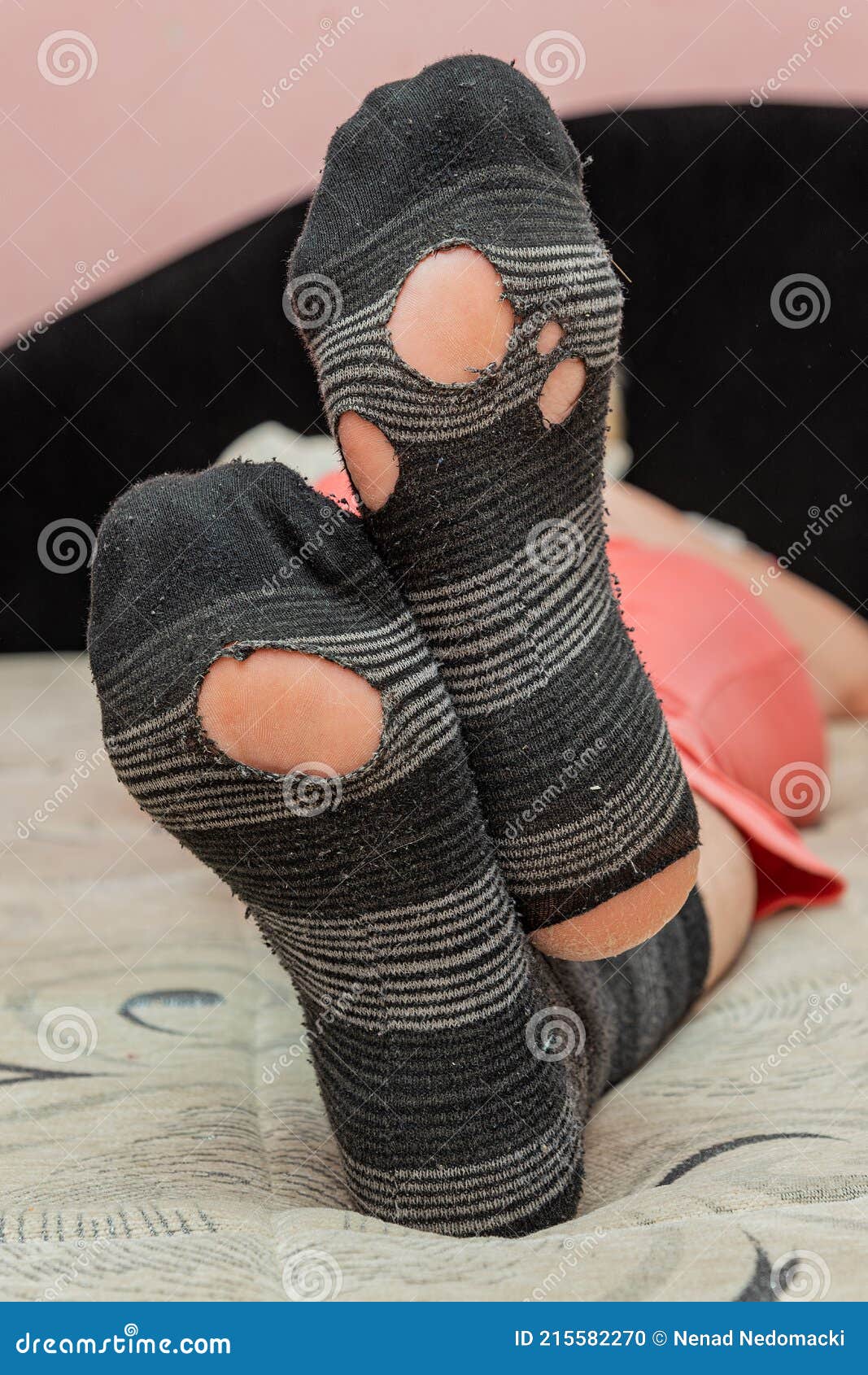 The Woman is Lying with Torn Socks. Worn Socks. Stock Photo - Image of ...