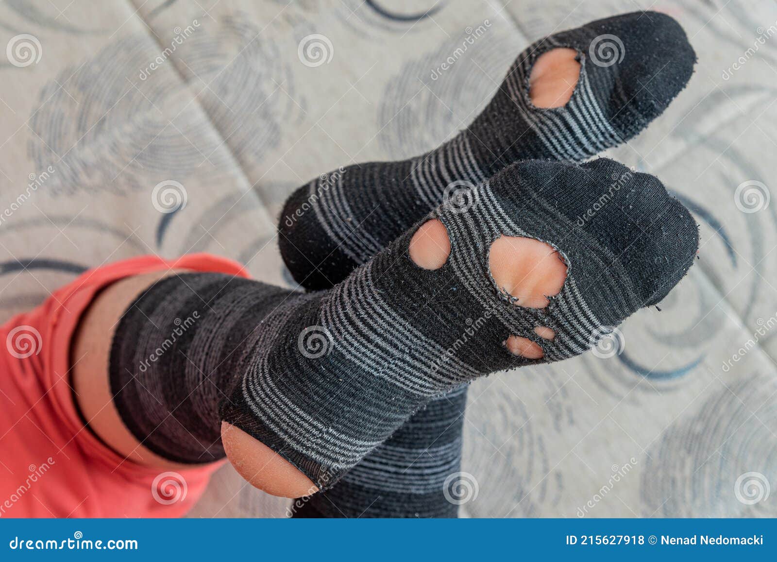 The Woman is Lying with Torn Socks. Worn Socks Stock Photo - Image of ...