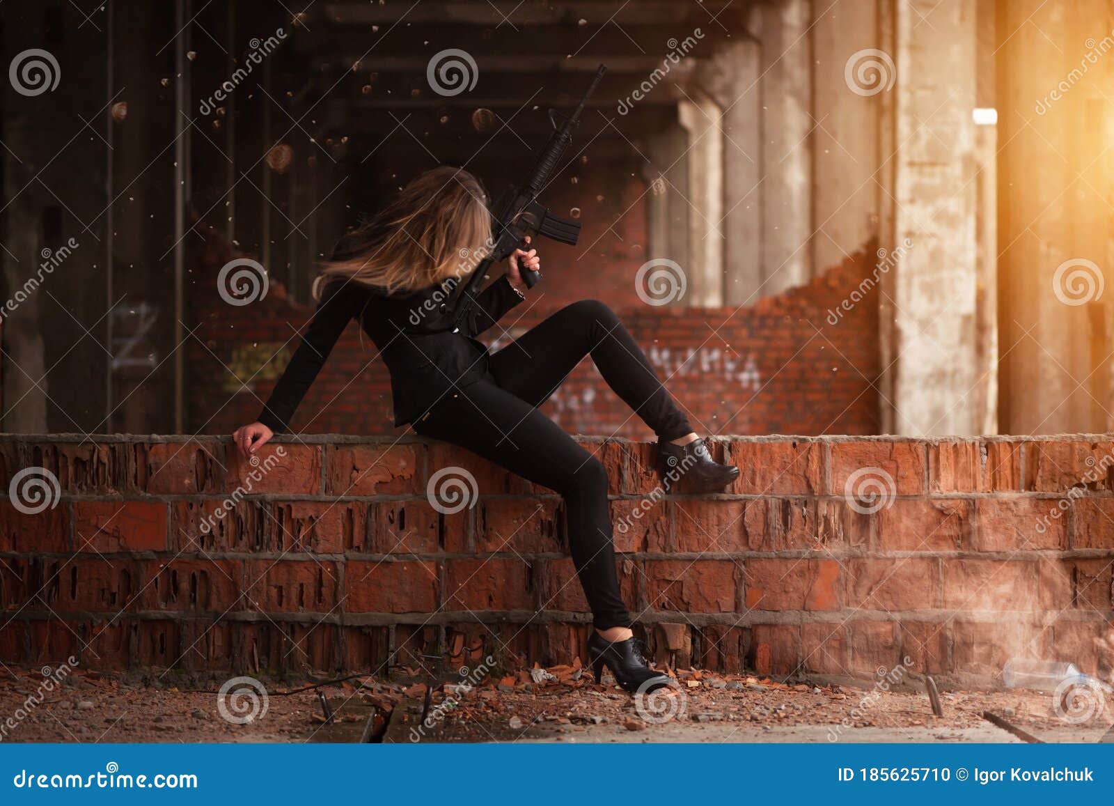 Woman with a machine gun stock photo. Image of action - 185625710