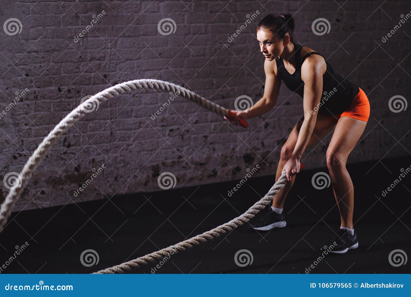 Woman Make Exercise with Battle Rope in Functional Training Gym Stock ...