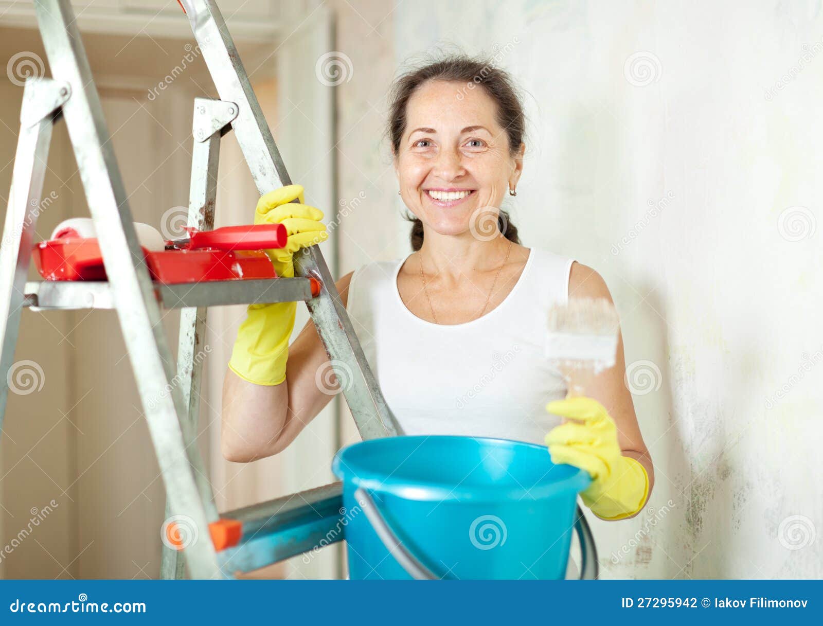 Woman Makes Repairs in Apartment Stock Photo - Image of color, brush ...