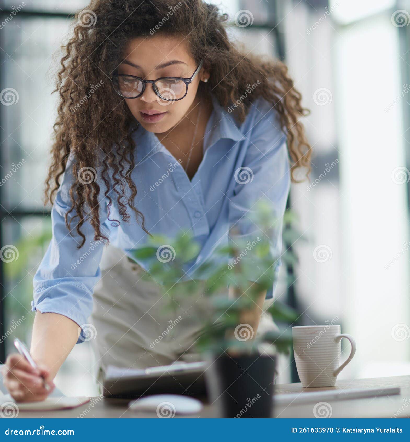 Woman Makes a Report in the Office. Woman Writing Notes for Educational ...