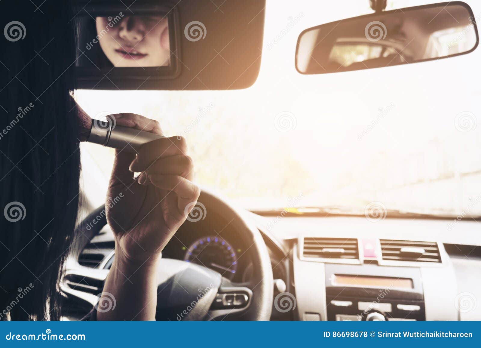 Woman Makeup Her Face Using Blush Brush while Driving Car Stock Photo ...