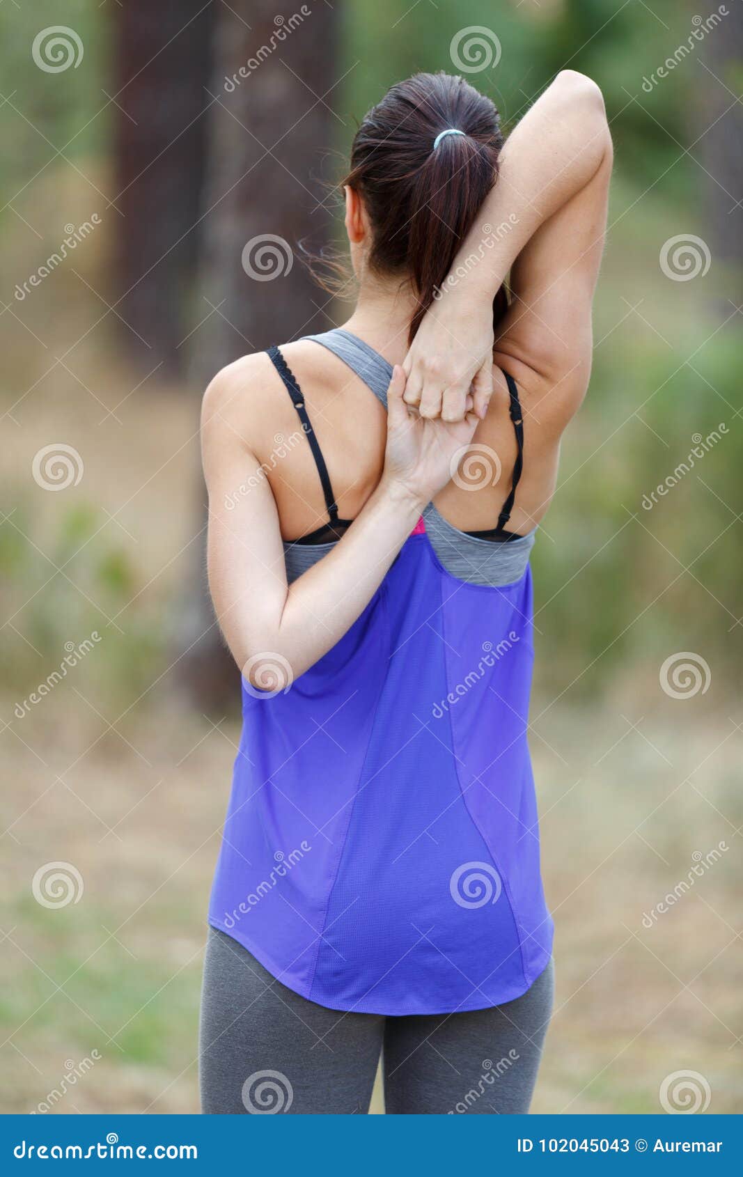 Woman making arm stretch stock image. Image of fitness - 102045043