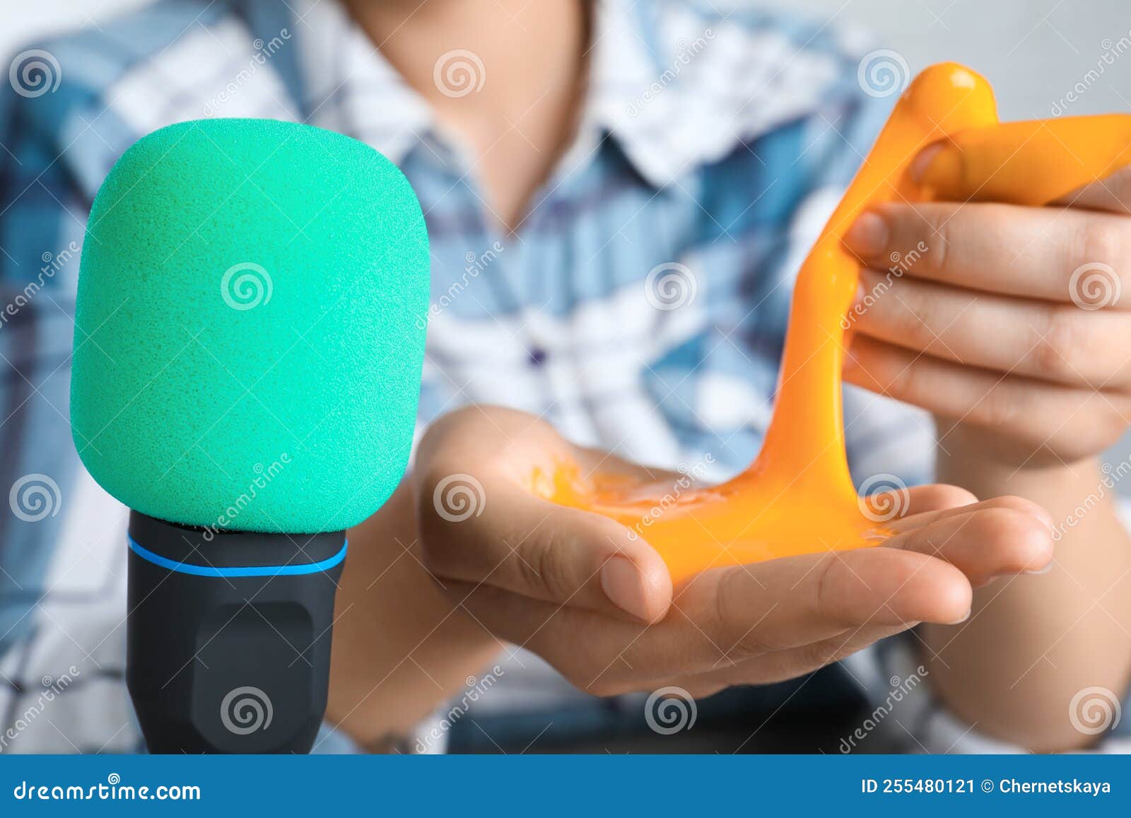 Woman Making ASMR Sounds with Microphone and Bright Slime, Closeup ...