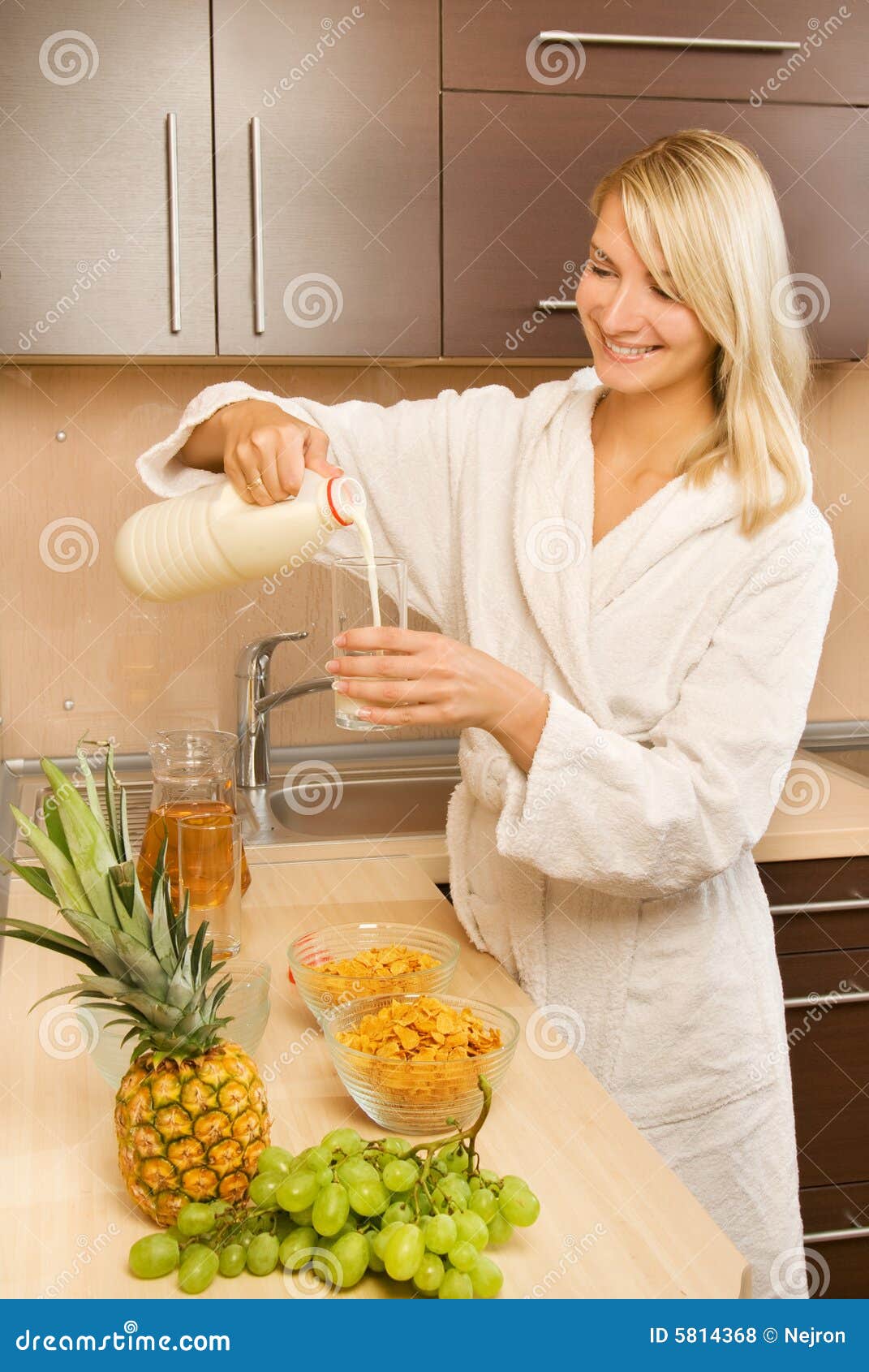 Woman making breakfast stock photo. Image of casual, bottle - 5814368