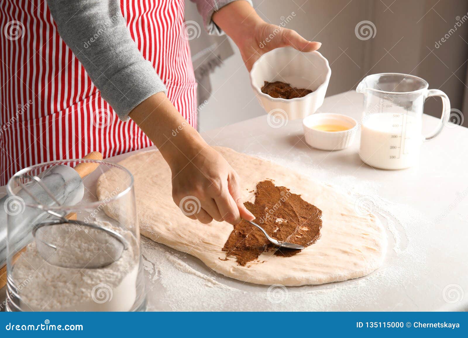 Woman Making Cinnamon Rolls at Table Stock Photo - Image of making ...