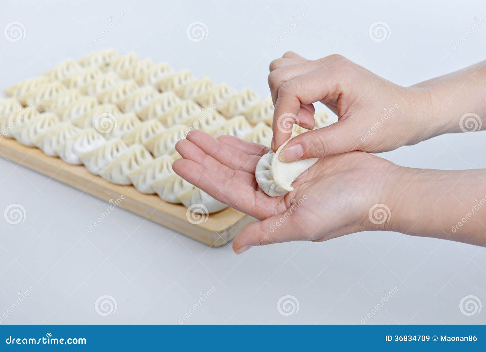 A woman making dumplings stock image. Image of year, woman - 36834709