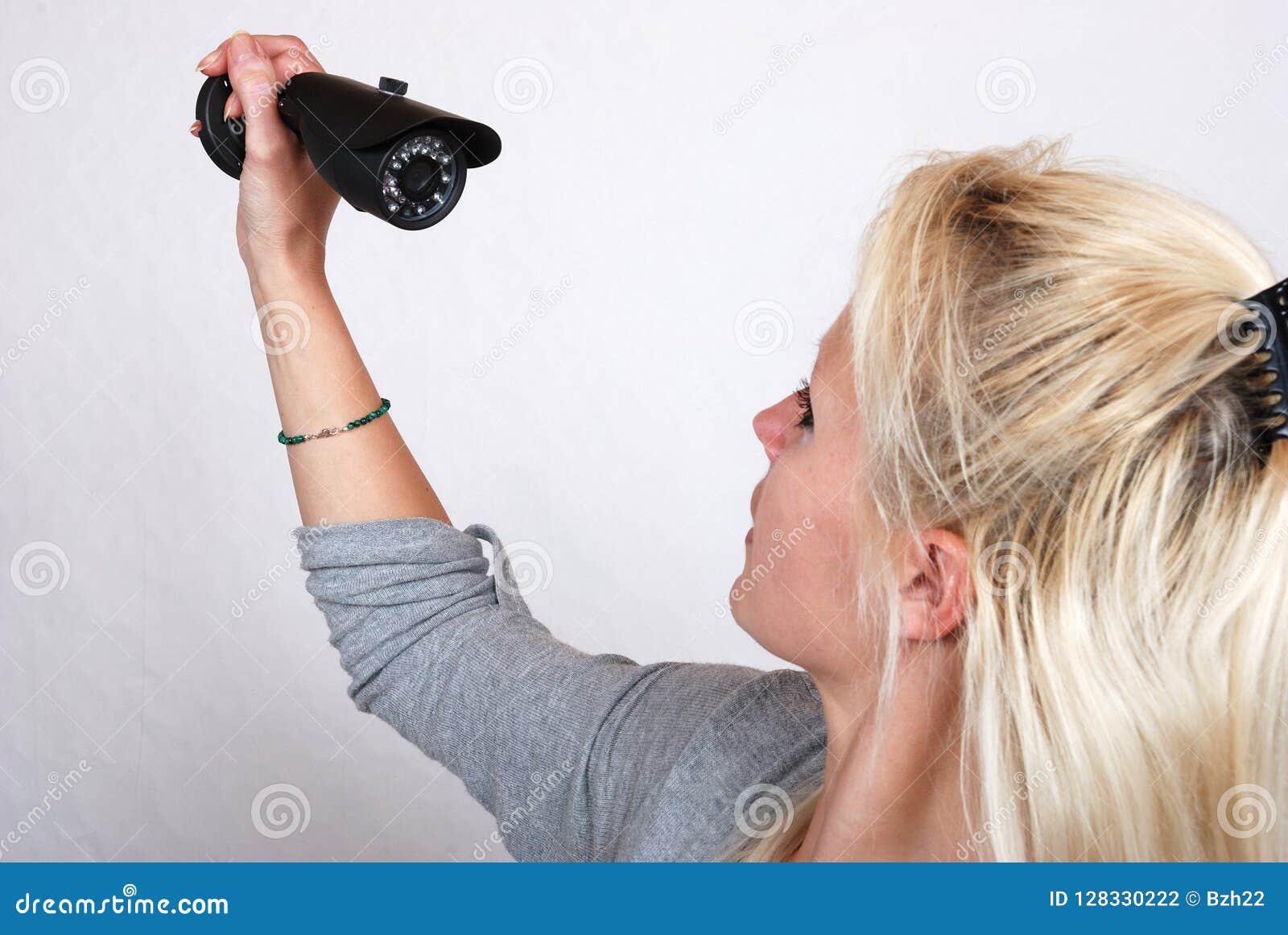 Woman Making Face at Security Camera Stock Photo - Image of watching ...