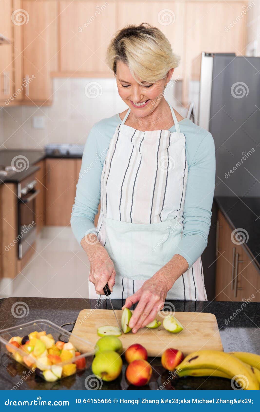 Woman making fruit salad stock photo. Image of fruits - 64155686