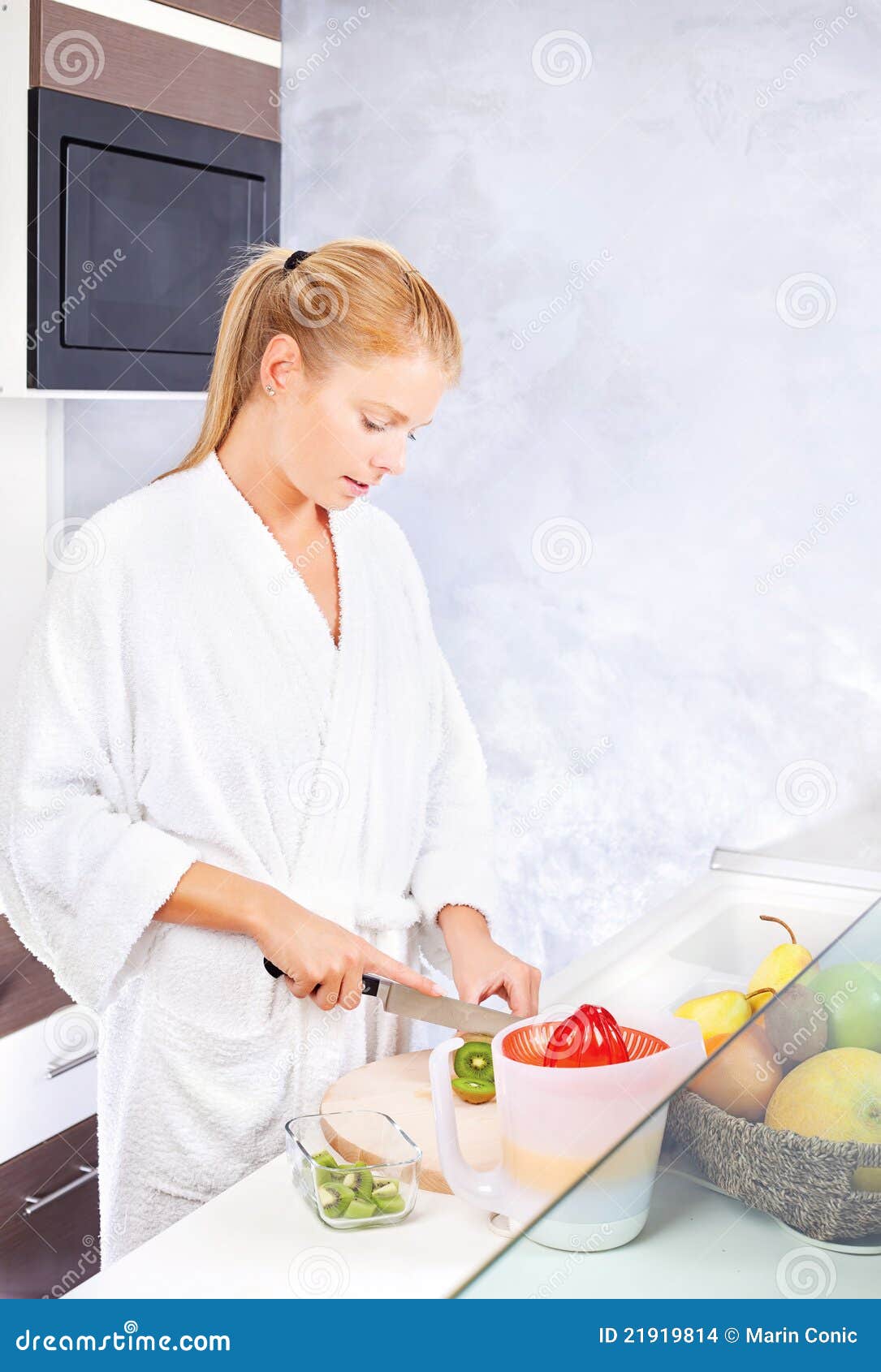 Woman Making Fruit Salad in Kitchen Stock Photo - Image of blond, fruit ...