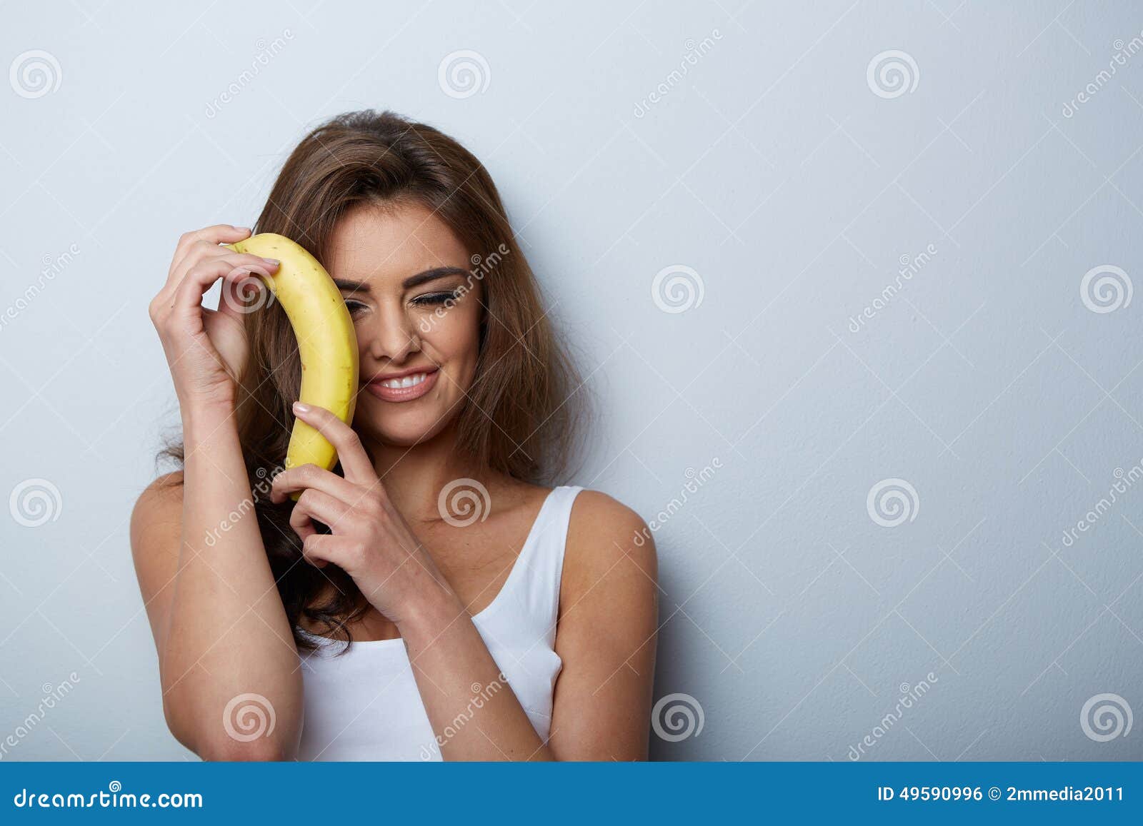 Woman Making Fun with a Banana Stock Photo - Image of phone, clear ...