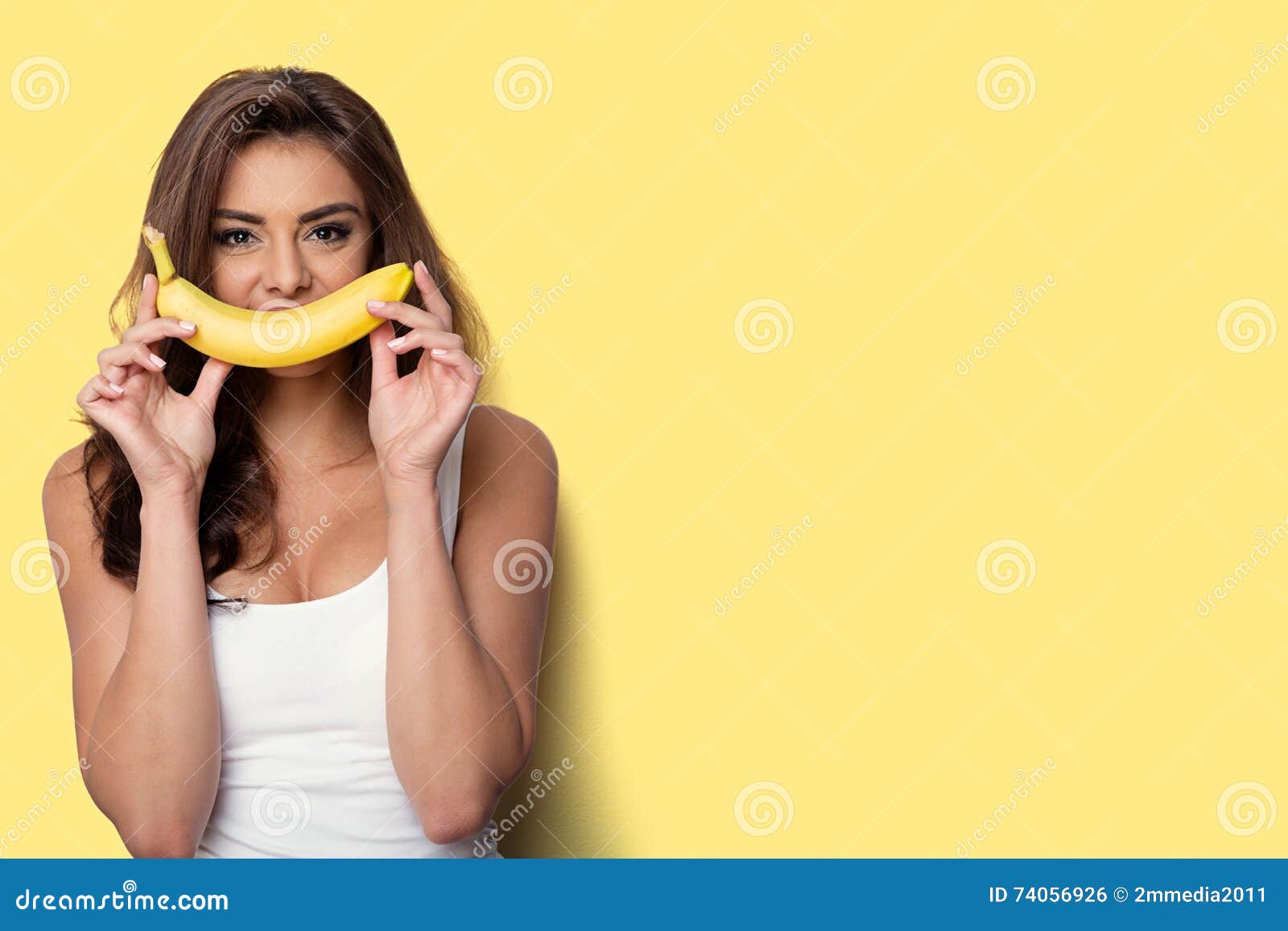 Woman Making Fun with a Banana. Stock Photo - Image of food, hair: 74056926